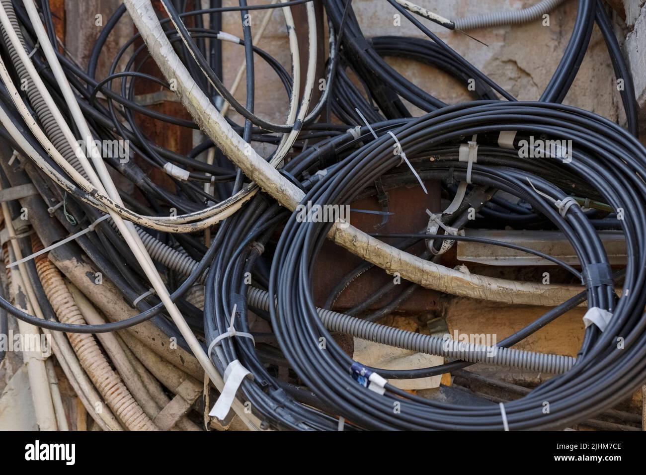 A pile of electrical wiring providing electricity to a building in a ...