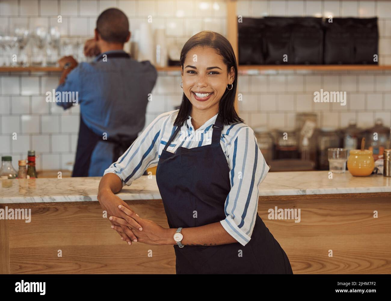 Barista in her cafe kitchen. Business owner working in her coffeeshop ...