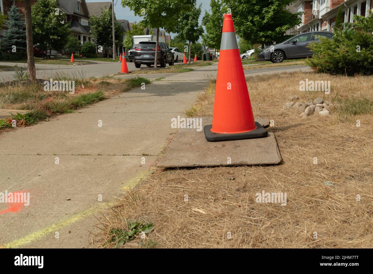 Repairs on the road section are marked with soft red cones Stock Photo ...