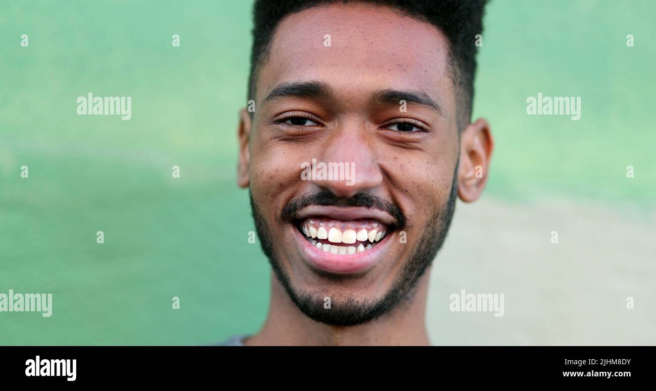 Happy young black man laughing and smiling. African ethnicity real life ...