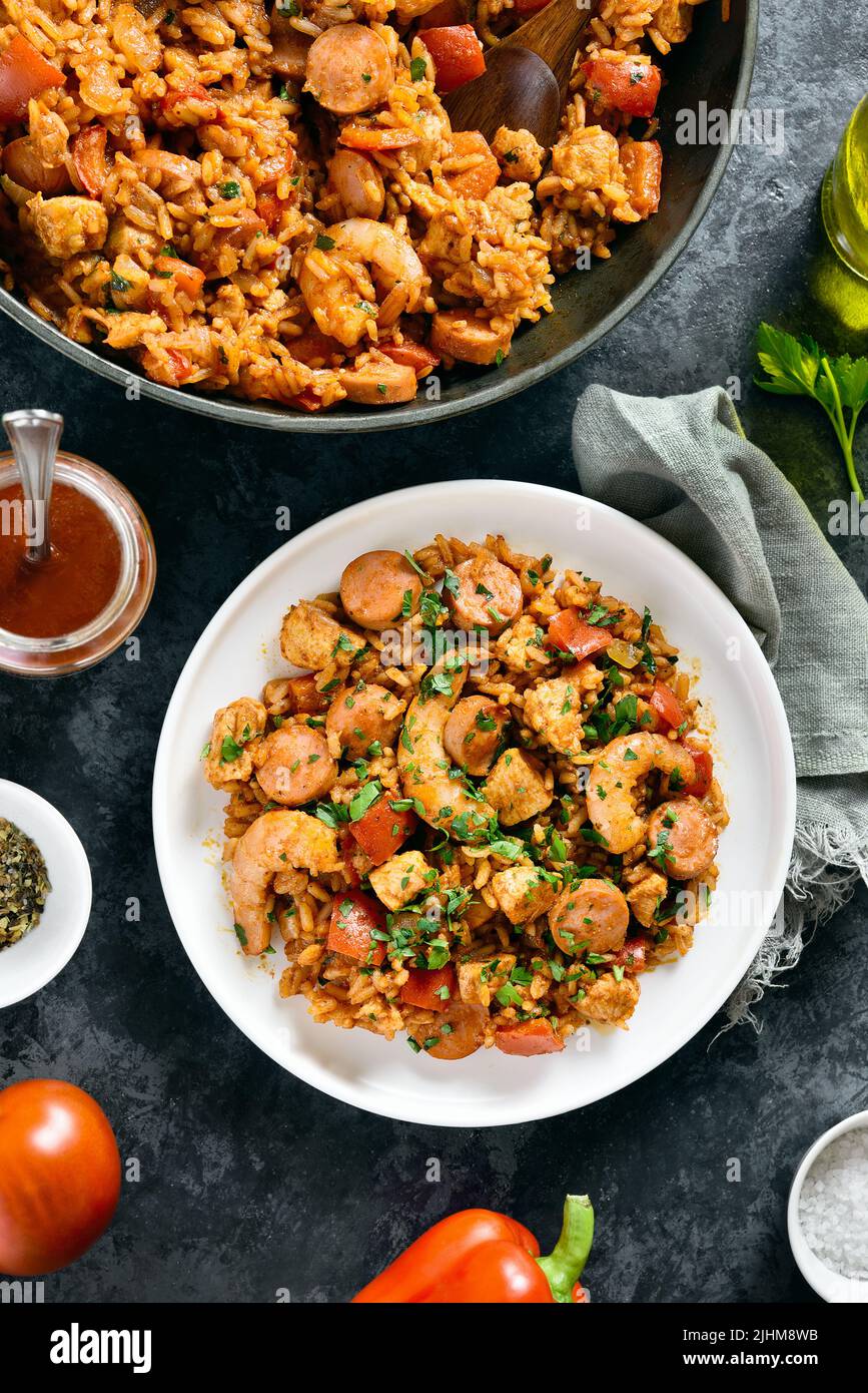 Creole jambalaya with rice, smoked sausages, chicken meat and ...