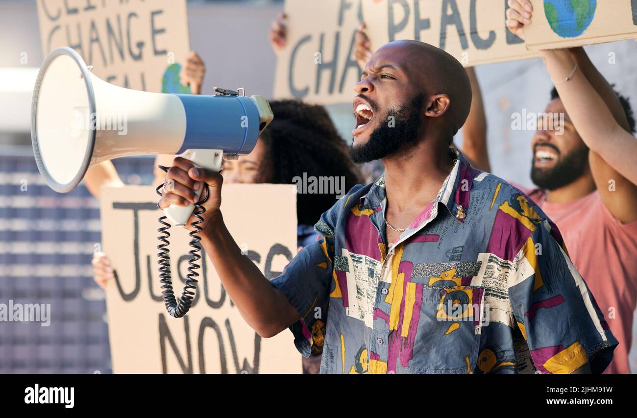No change happens on its own. a group of young people protesting in the ...