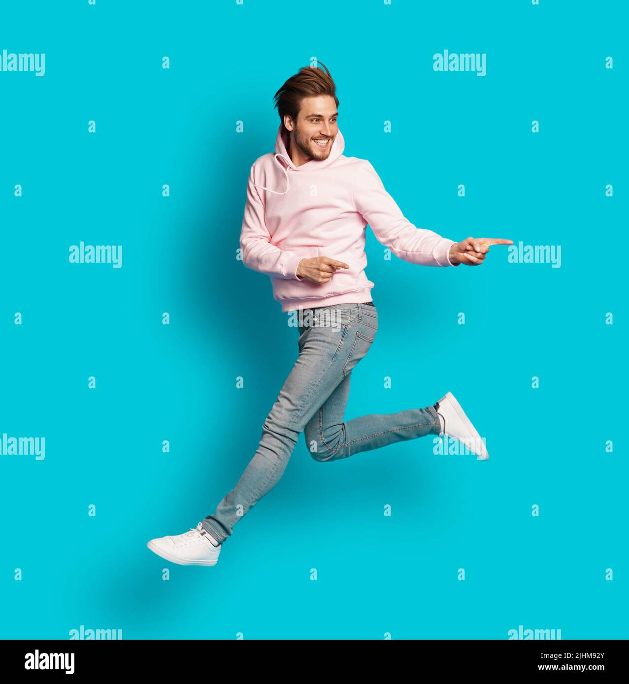 Full size photo of young happy excited smiling positive man jumping ...