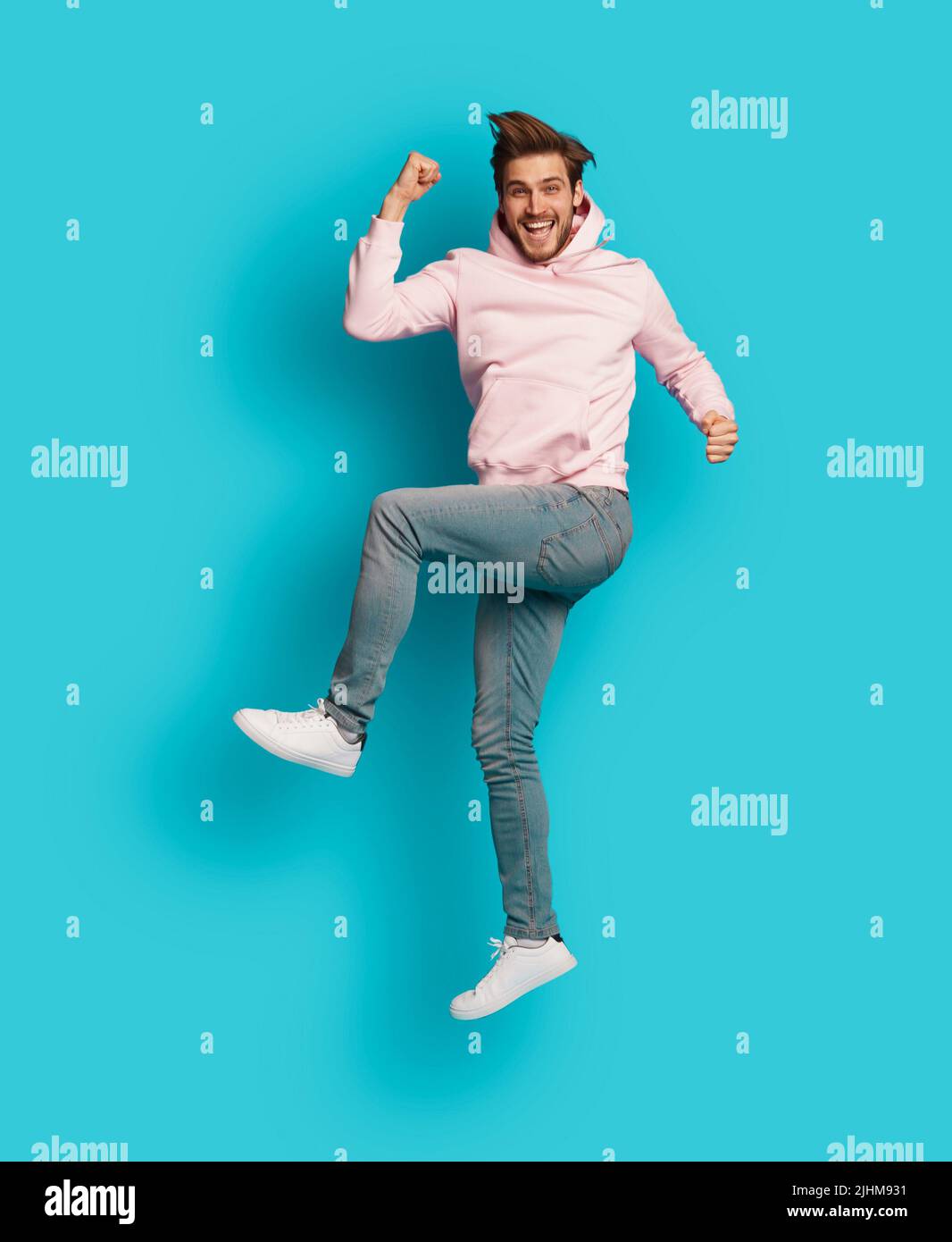 Full size photo of young happy excited smiling positive man jumping ...