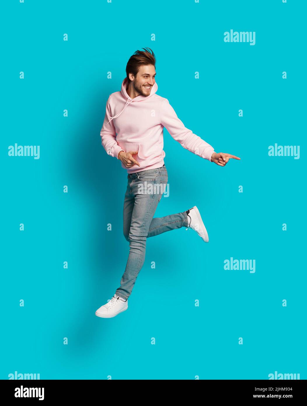 Full size photo of young happy excited smiling positive man jumping ...