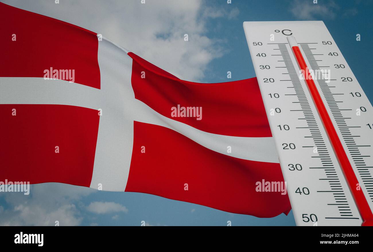 Heat wave in Denmark, Thermometer in front of flag Denmark and sky ...