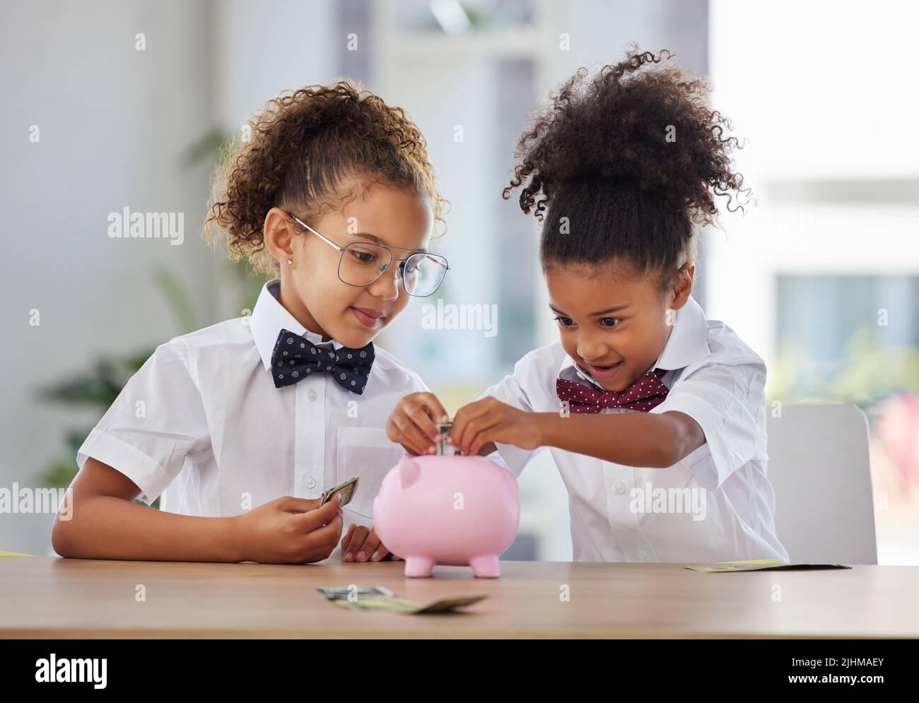 Get in there. two adorable little girls dressed as businesspeople ...