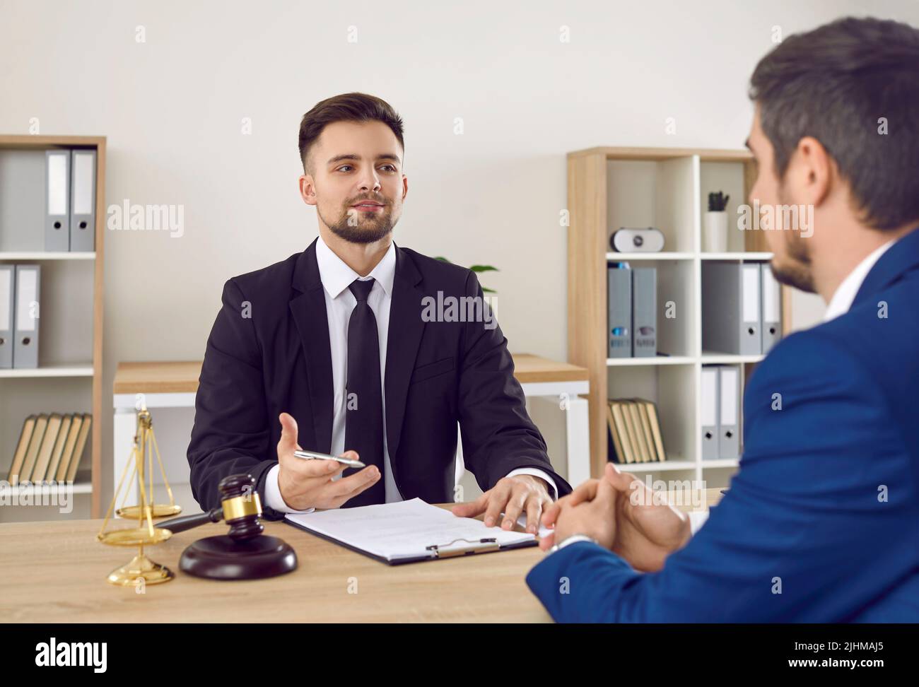 Lawyer meeting with client, providing law consultation, giving legal ...