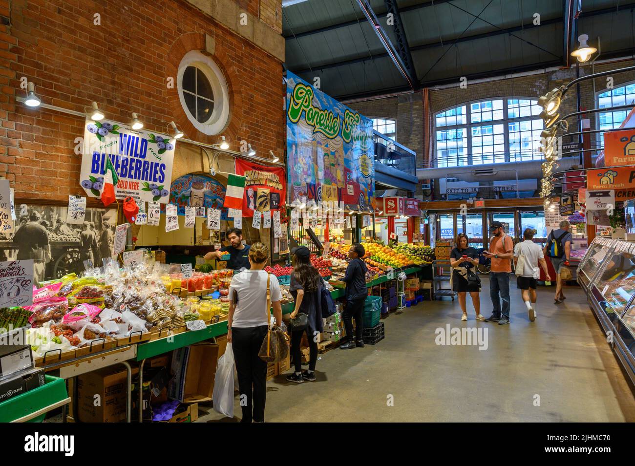 Inside St. Lawrence Market with fruit and vegetable stalls in downtown ...
