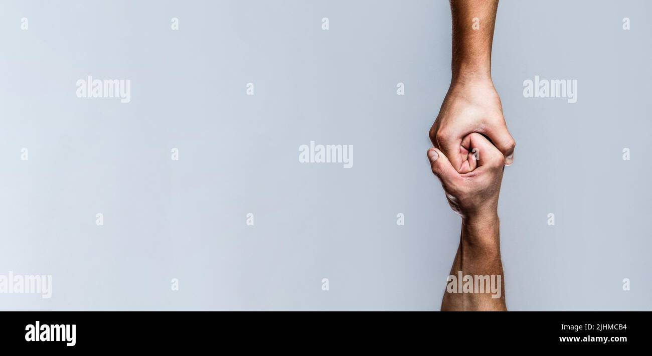 Helping hand concept and international day of peace, support. Two hands ...