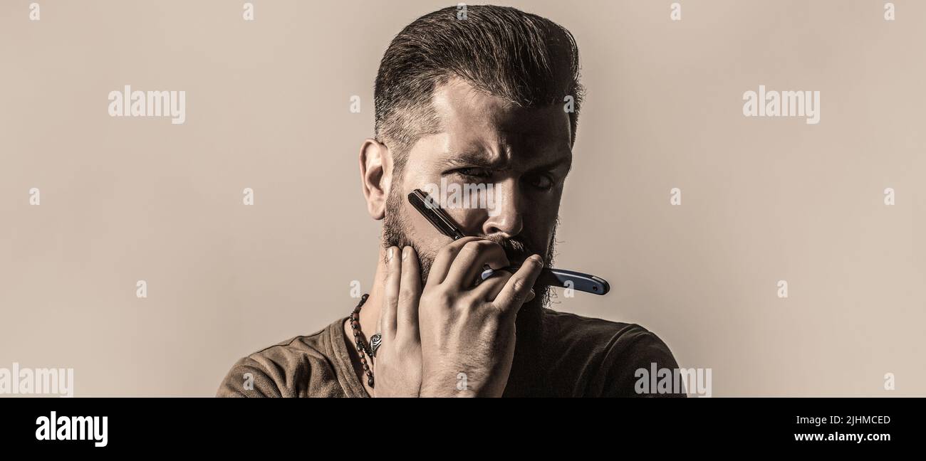 Vintage straight razor. Mens haircut. Man in barbershop. Handsome ...