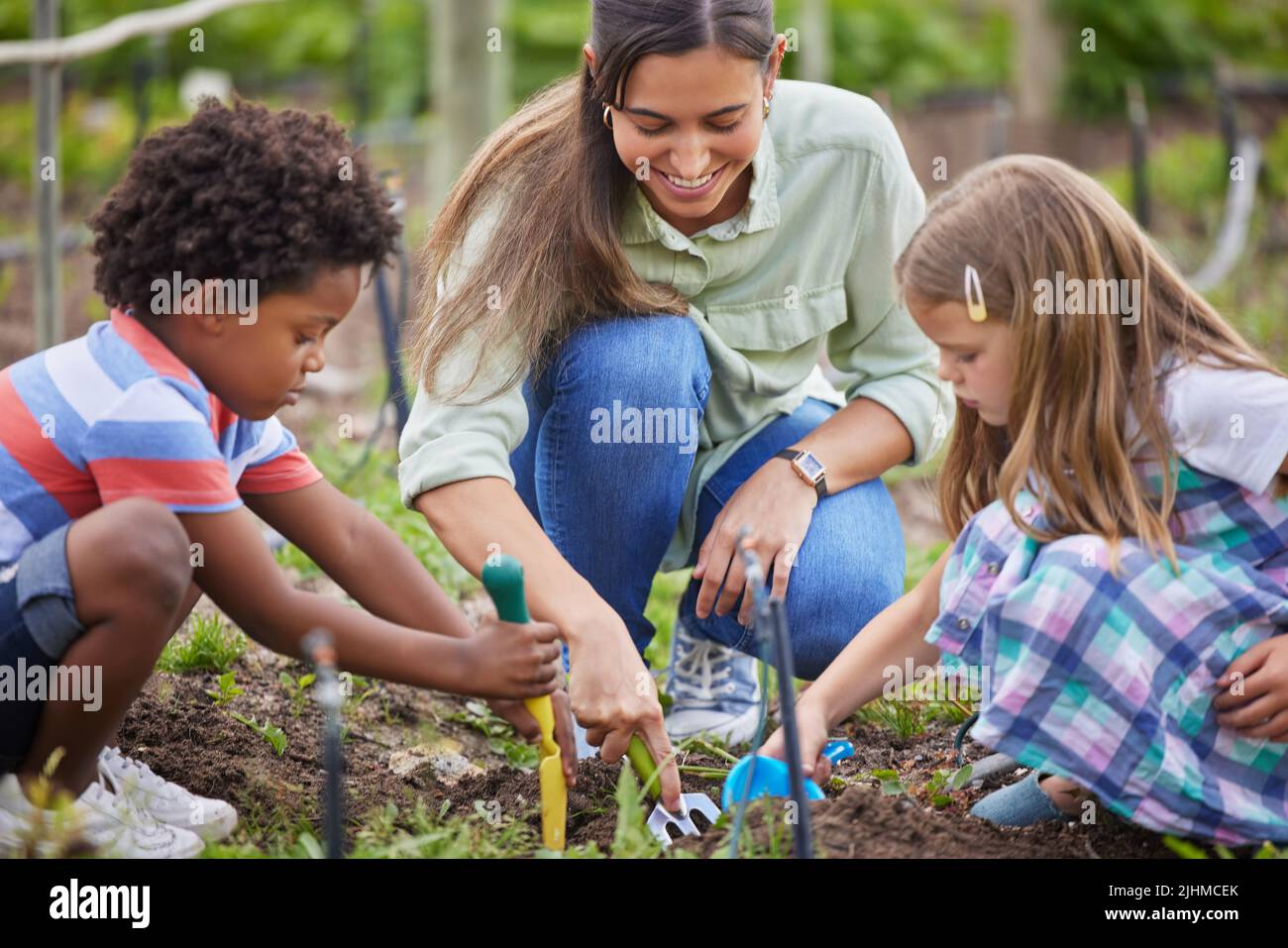 Learning about the importance of farming. an attractive young woman and ...