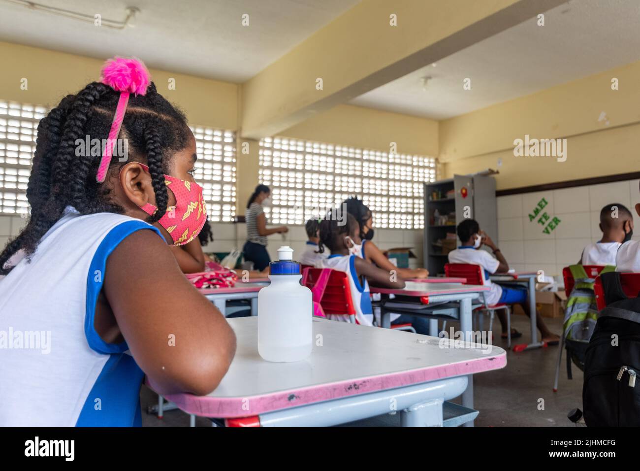 Students studying in a classroom after returning to face-to-face ...