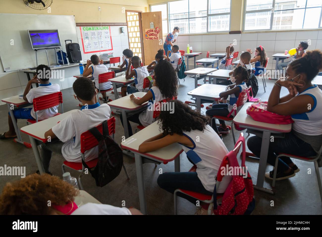 Students studying in a classroom after returning to face-to-face ...