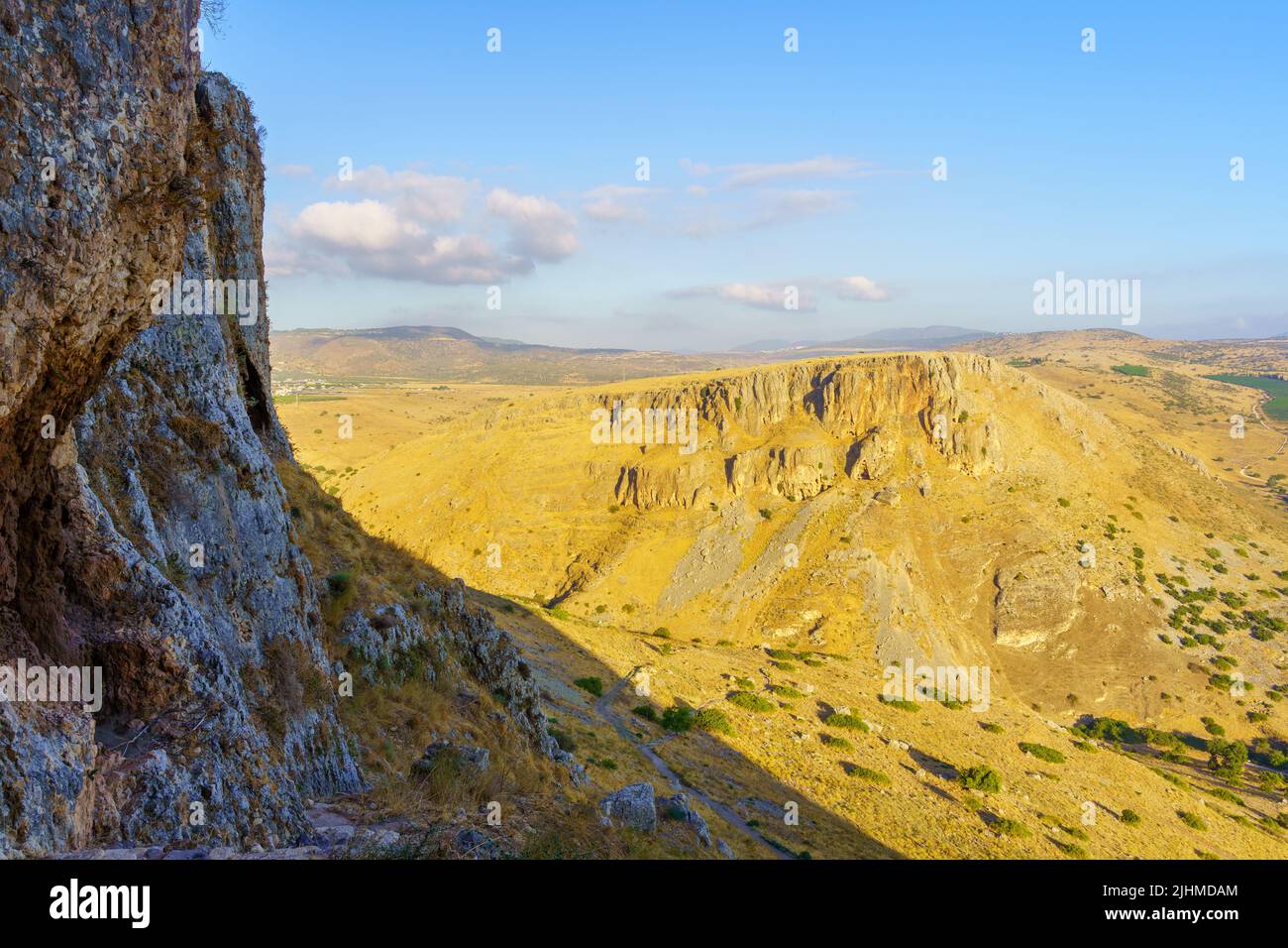 View of rocks, cliffs, footpath, and Mount Nitai, in Mount Arbel ...