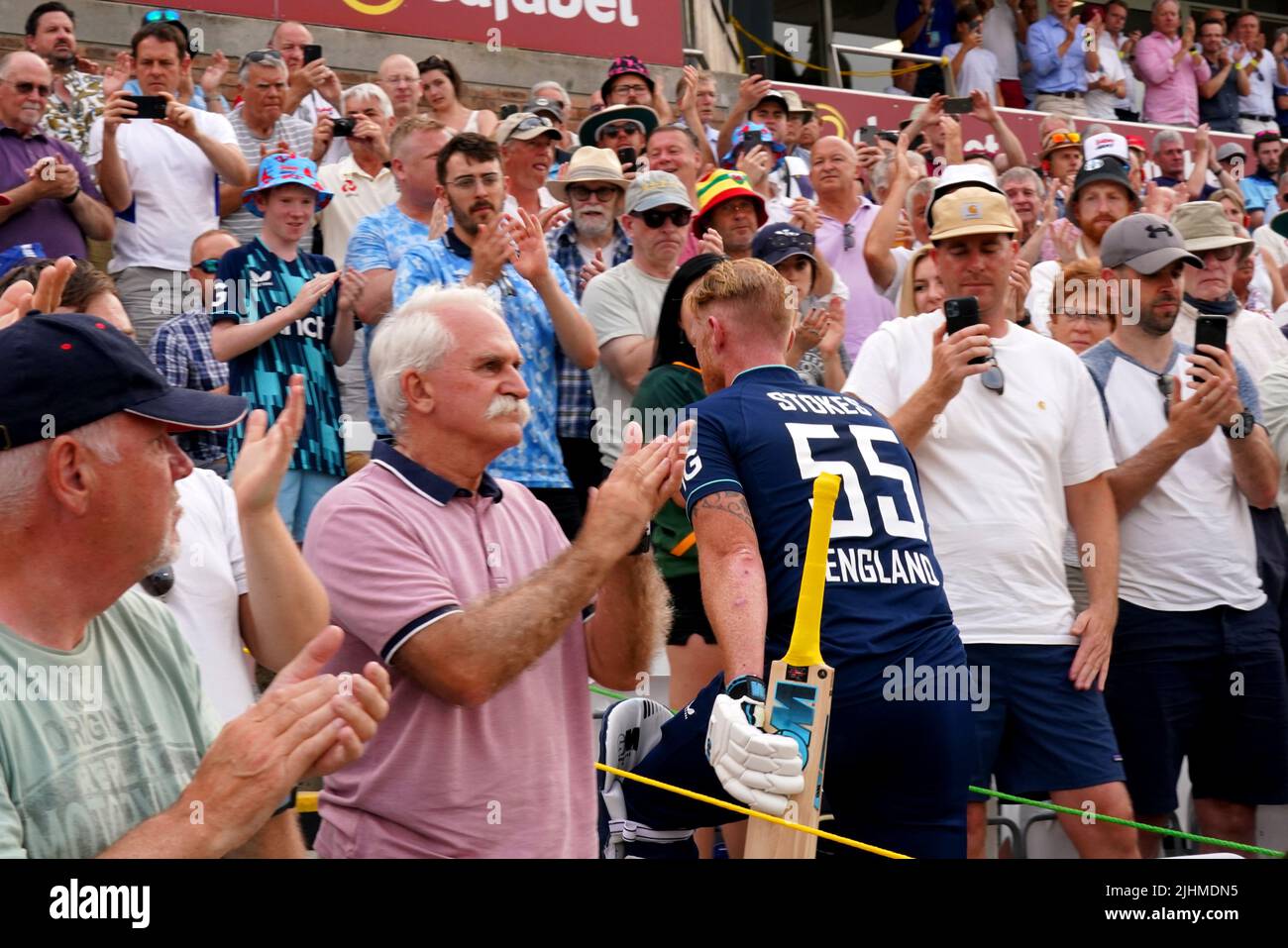 England's Ben Stokes is applauded by fans as he leaves the pitch after ...