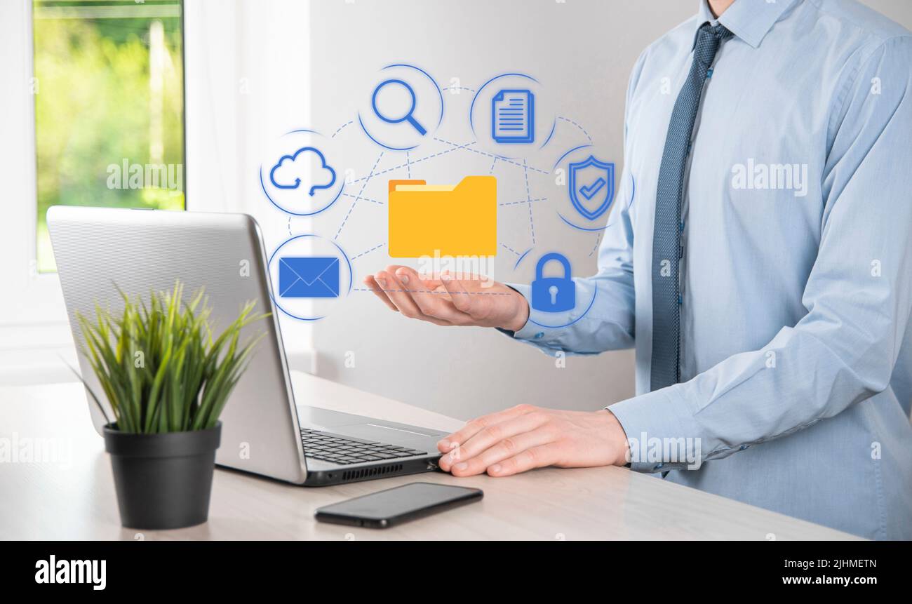 Document Management System DMS .Businessman hold folder and document ...