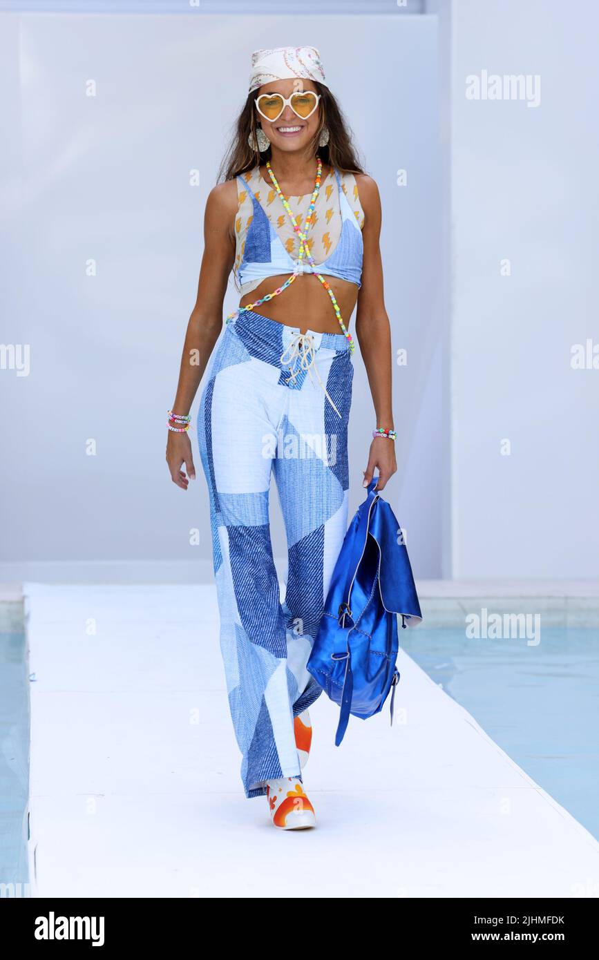 MIAMI BEACH, FLORIDA - JULY 18: A model walks the runway wearing Mamie ...