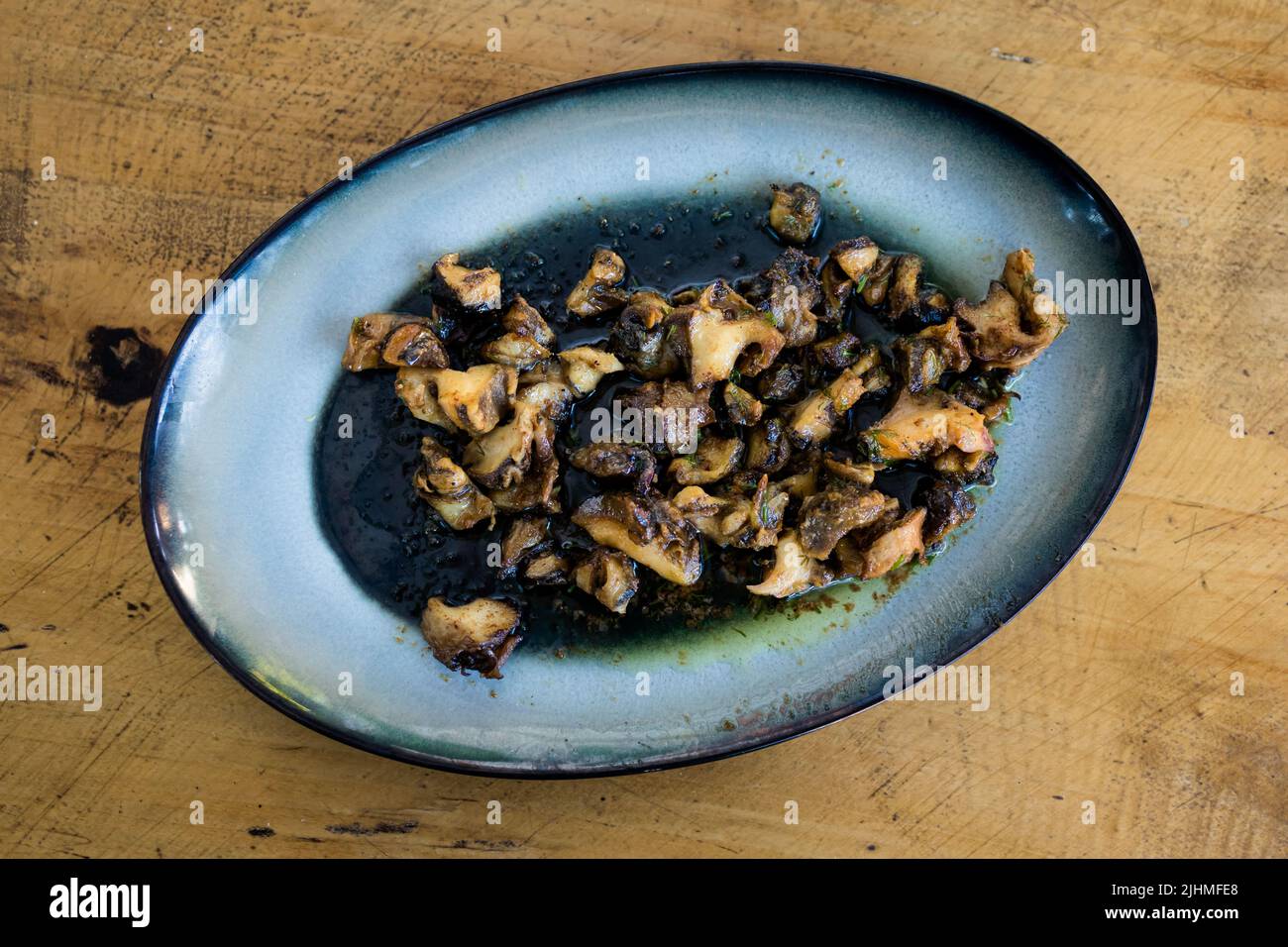 Delicious colorful local food snails in a restaurant, Burgas ...
