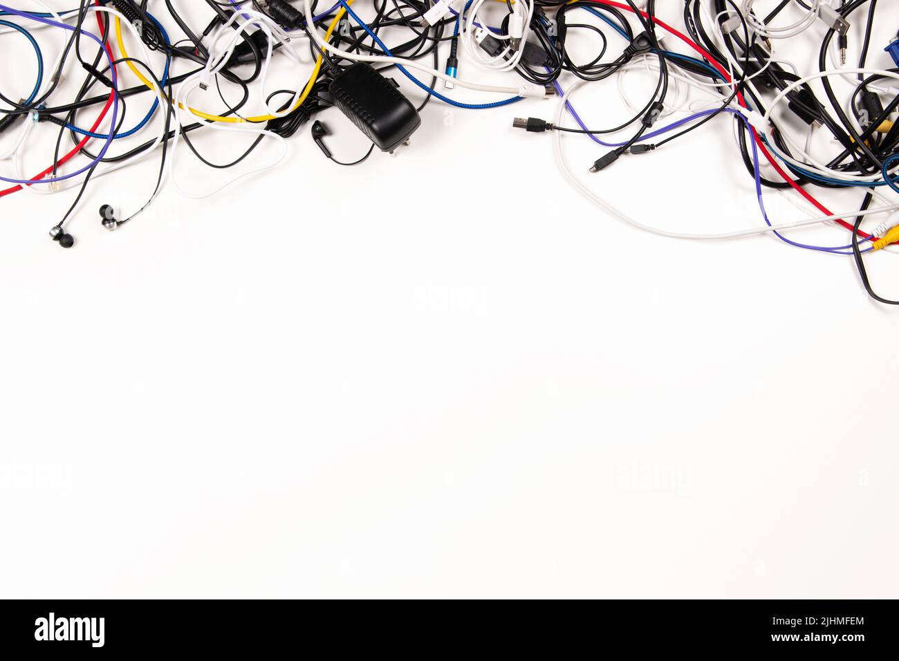 Many colorful electrical cord wires cables cord with plugs and electric ...