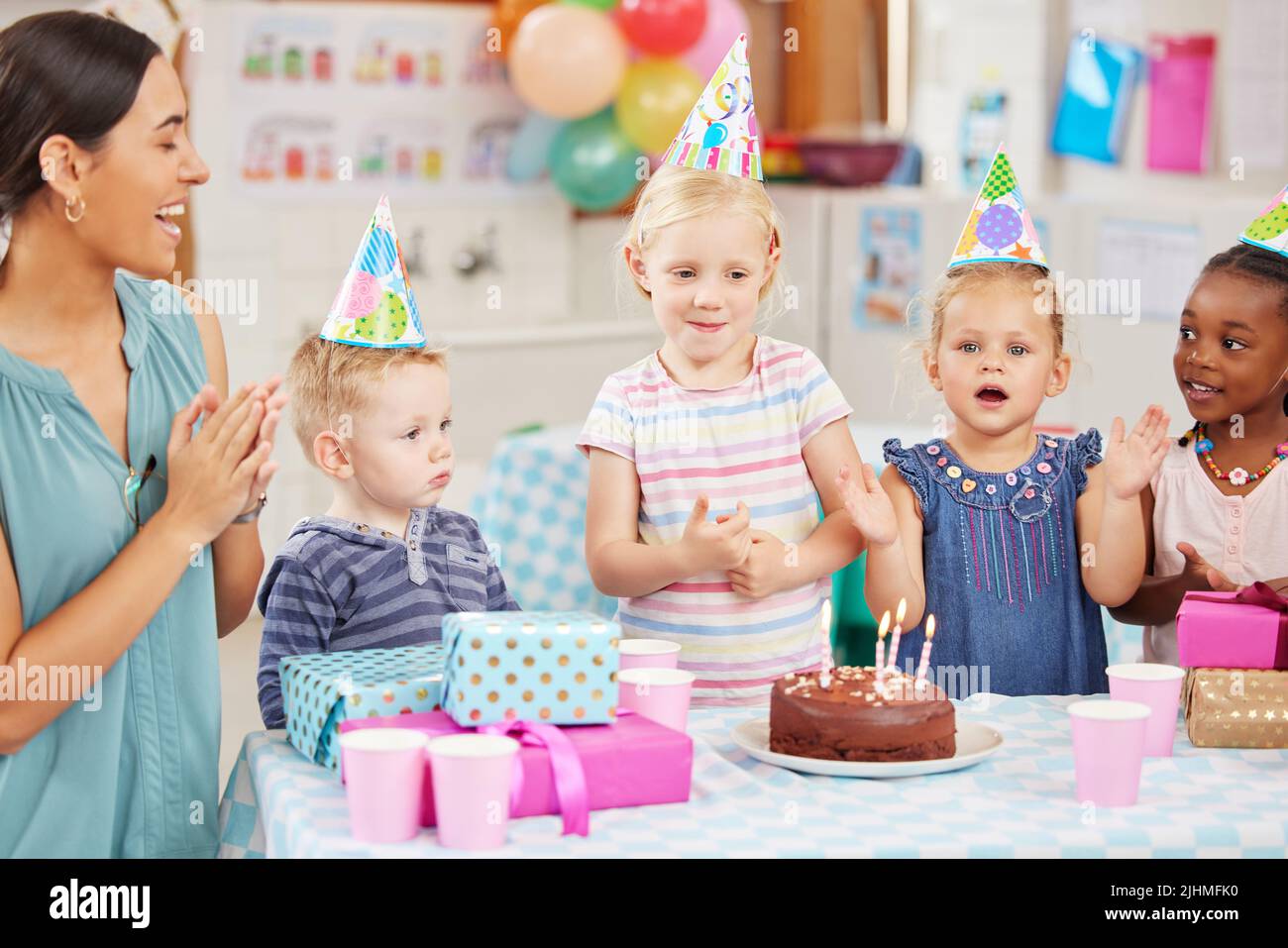 Singing to the birthday girl. a preschool children celebrating a ...