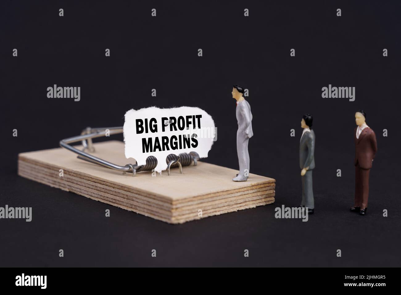 Business trap, crisis concept. Figures of businessmen stand near a ...