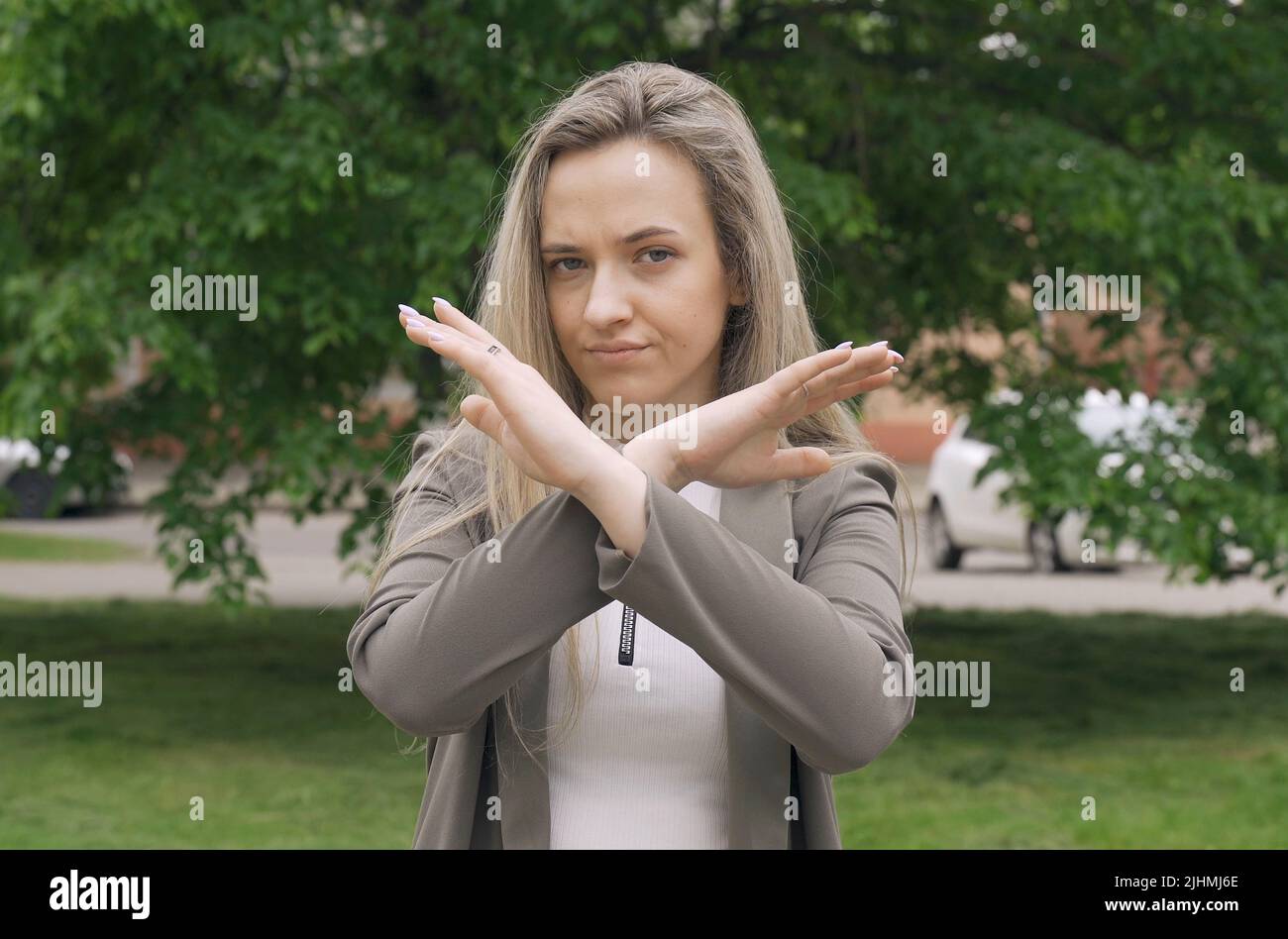 Young woman shows no gesture with hands. Emotions and gestures Stock ...