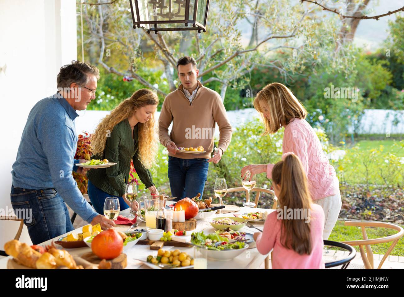 Family preparing for dinner hi-res stock photography and images - Alamy
