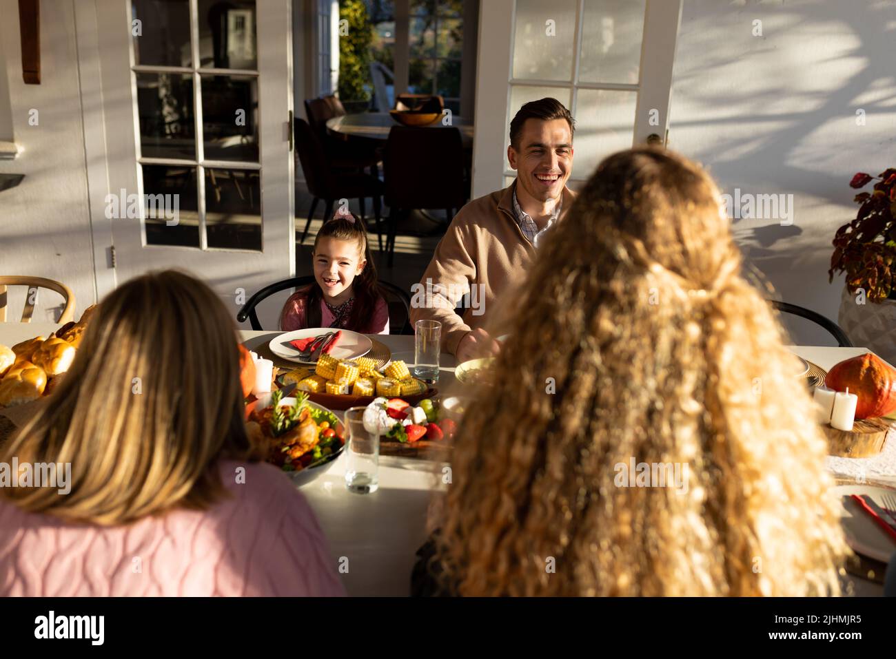 Image of multi generation caucasian family eating outdoor dinner Stock ...
