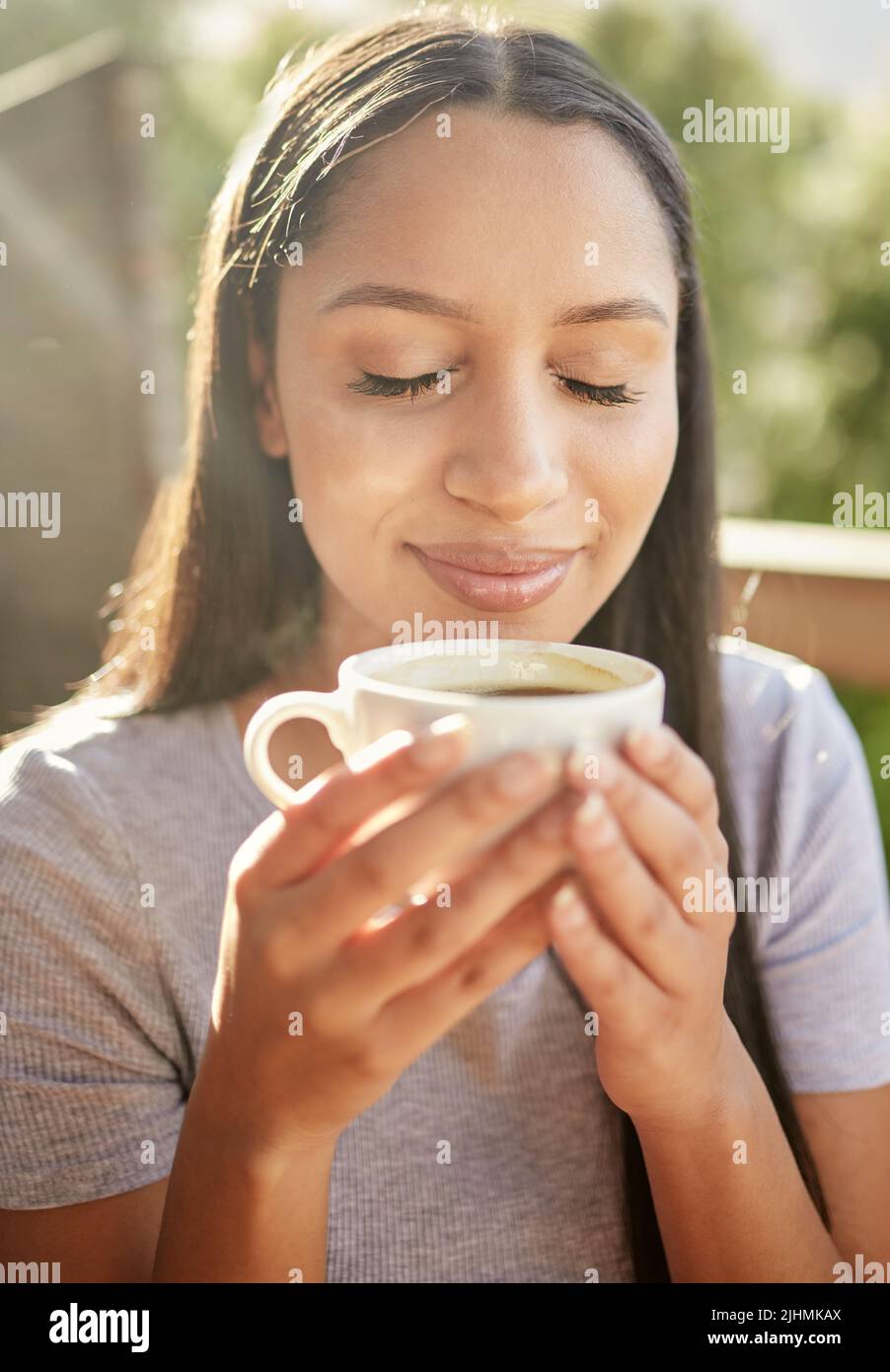 Nothing beats the smell of coffee in the morning. an attractive young ...