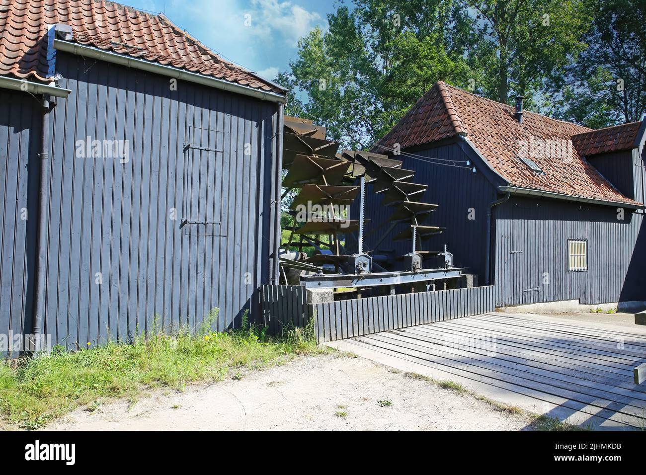 Two scenic idyllic ancient wooden gray dutch country grist and oil ...