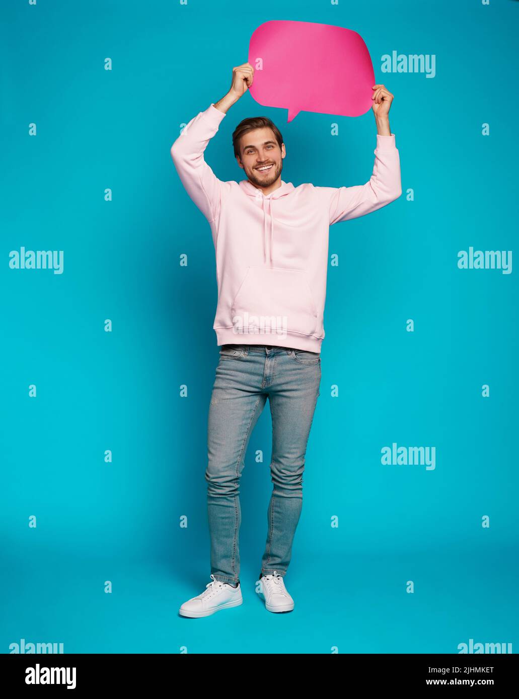 Image of emotional excited young man posing isolated over light blue ...