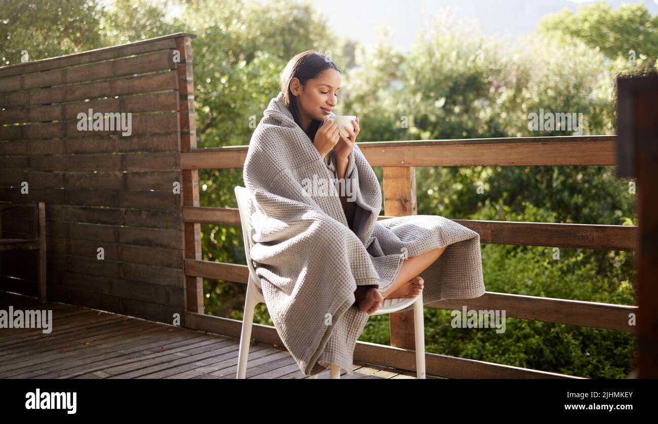 I love to enjoy the morning sun. Full length shot of an attractive ...
