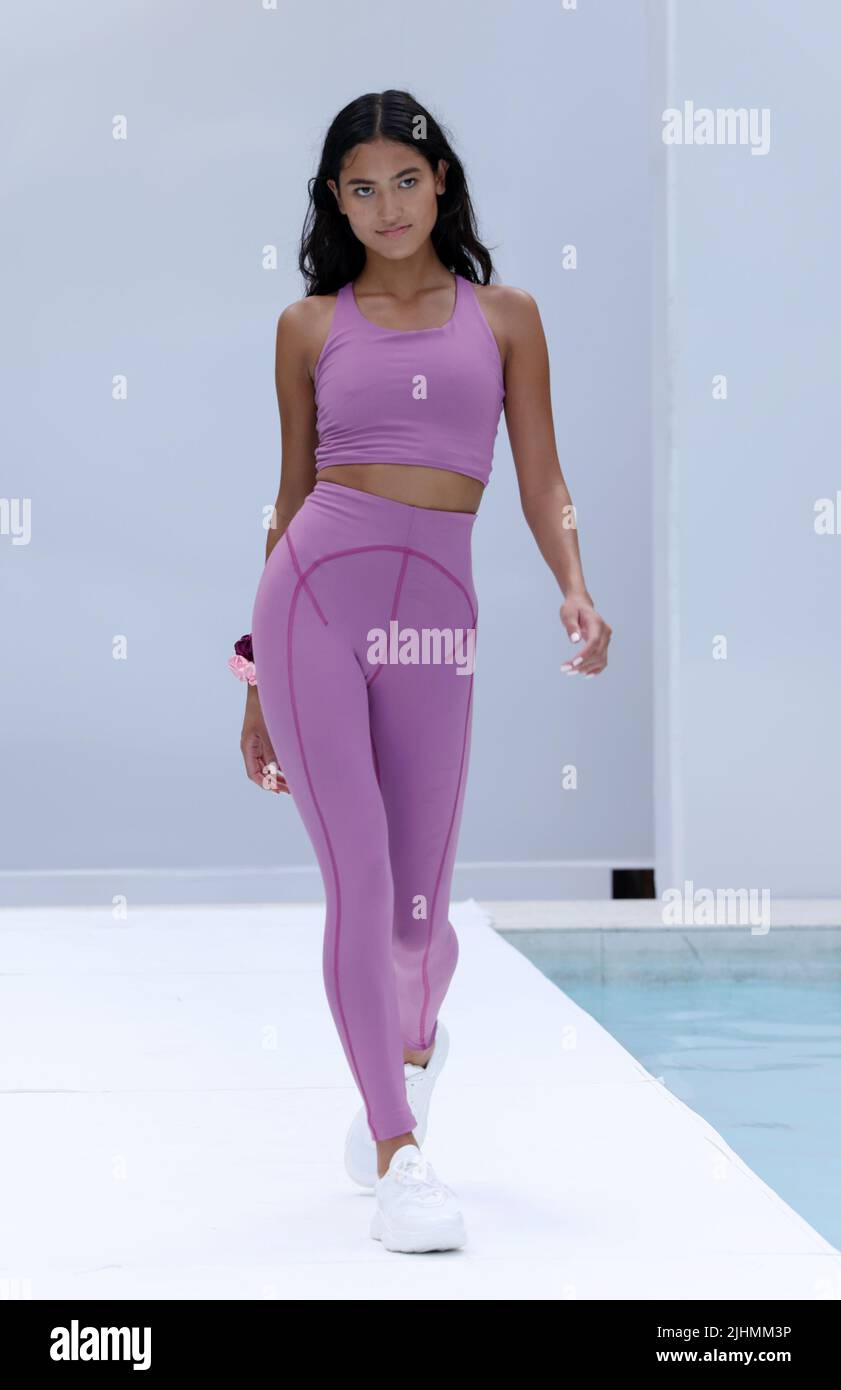 MIAMI BEACH, FLORIDA - JULY 18: A model walks the runway wearing Rio Yoga during Flying Solo ...