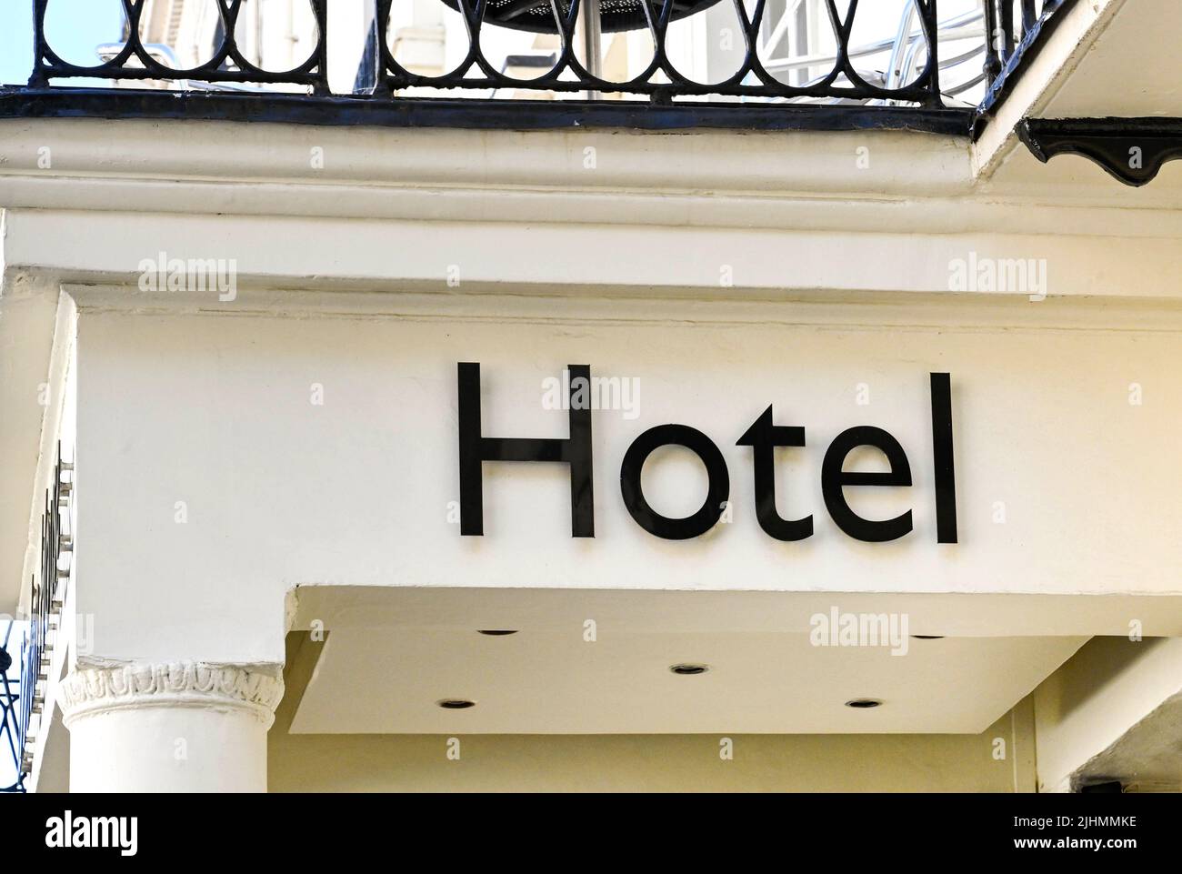 Sign above the entrance of a hotel. No people Stock Photo - Alamy