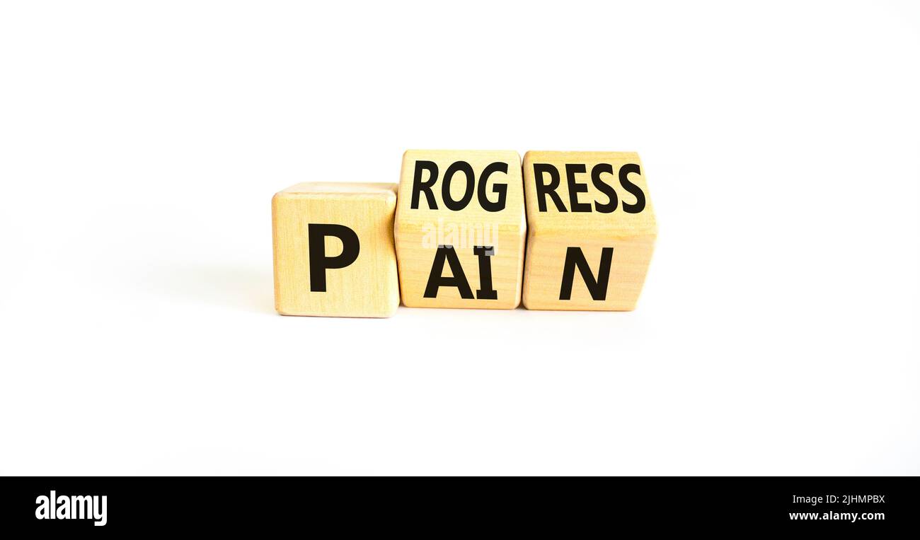 Pain or progress symbol. Concept words Pain or Progress on wooden cubes. Beautiful white table ...