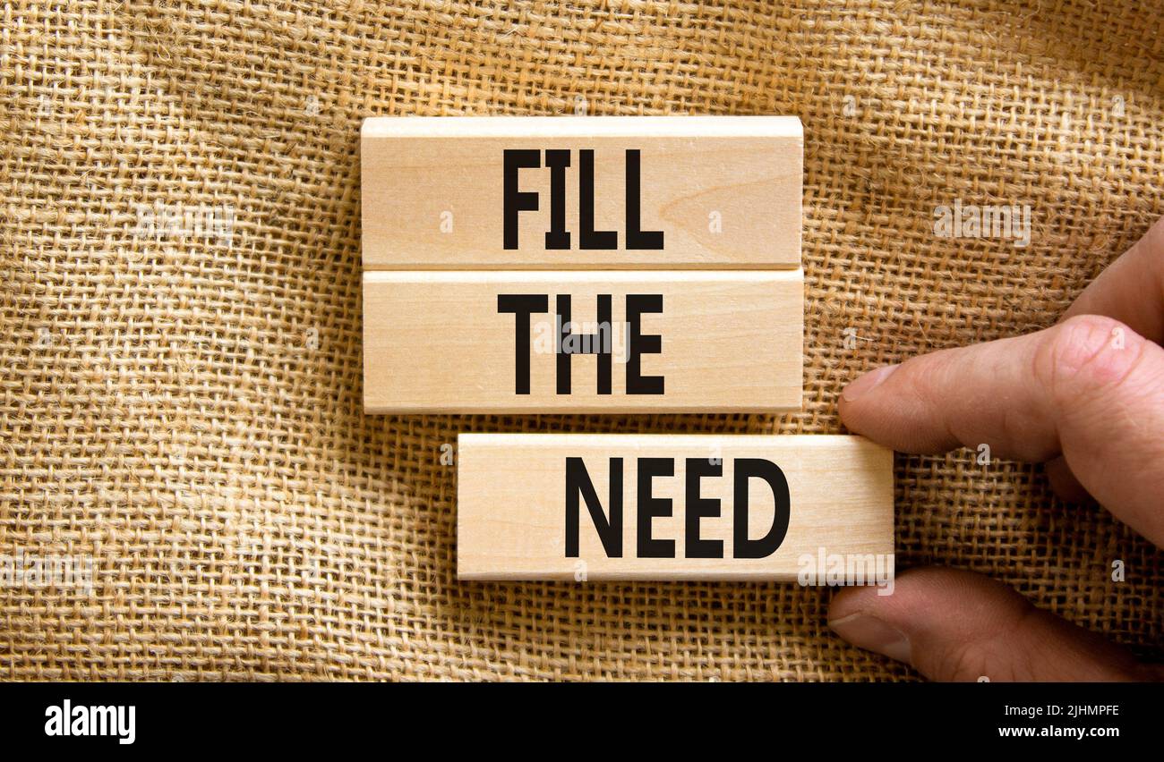 Fill the need symbol. Concept words Fill the need on wooden blocks on a ...