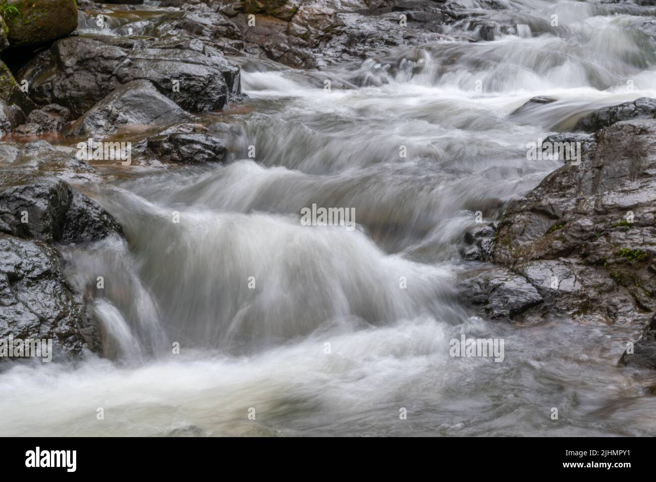 Natural rain water flowing from rocks during monsoon rainy season Stock ...