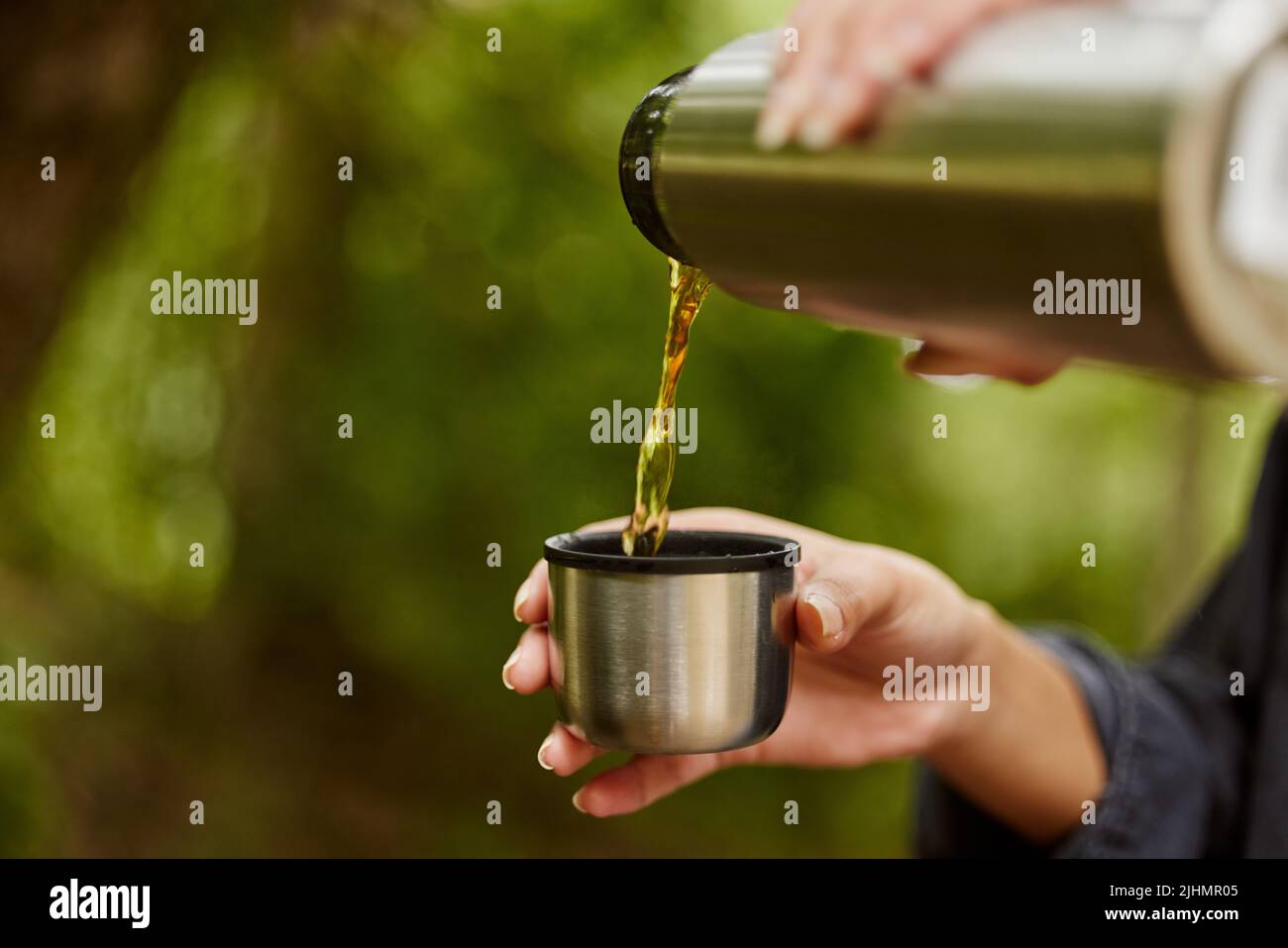 Time for some coffee. an unrecognizable woman drinking some coffee ...