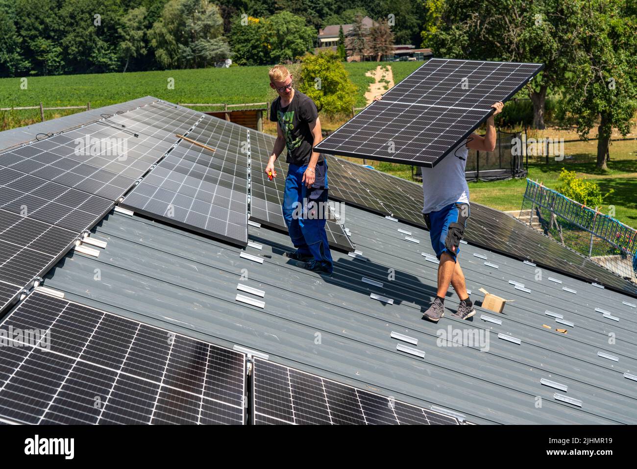 Installation of solar modules on the roof of a barn, a farm, over 240 ...