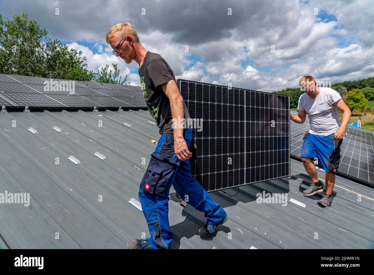 Installation of solar modules on the roof of a barn, a farm, over 240 ...