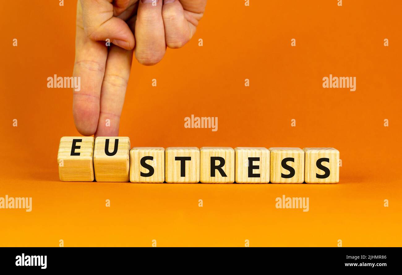 Eustress or stress symbol. Psychologist turns cubes and changes the ...