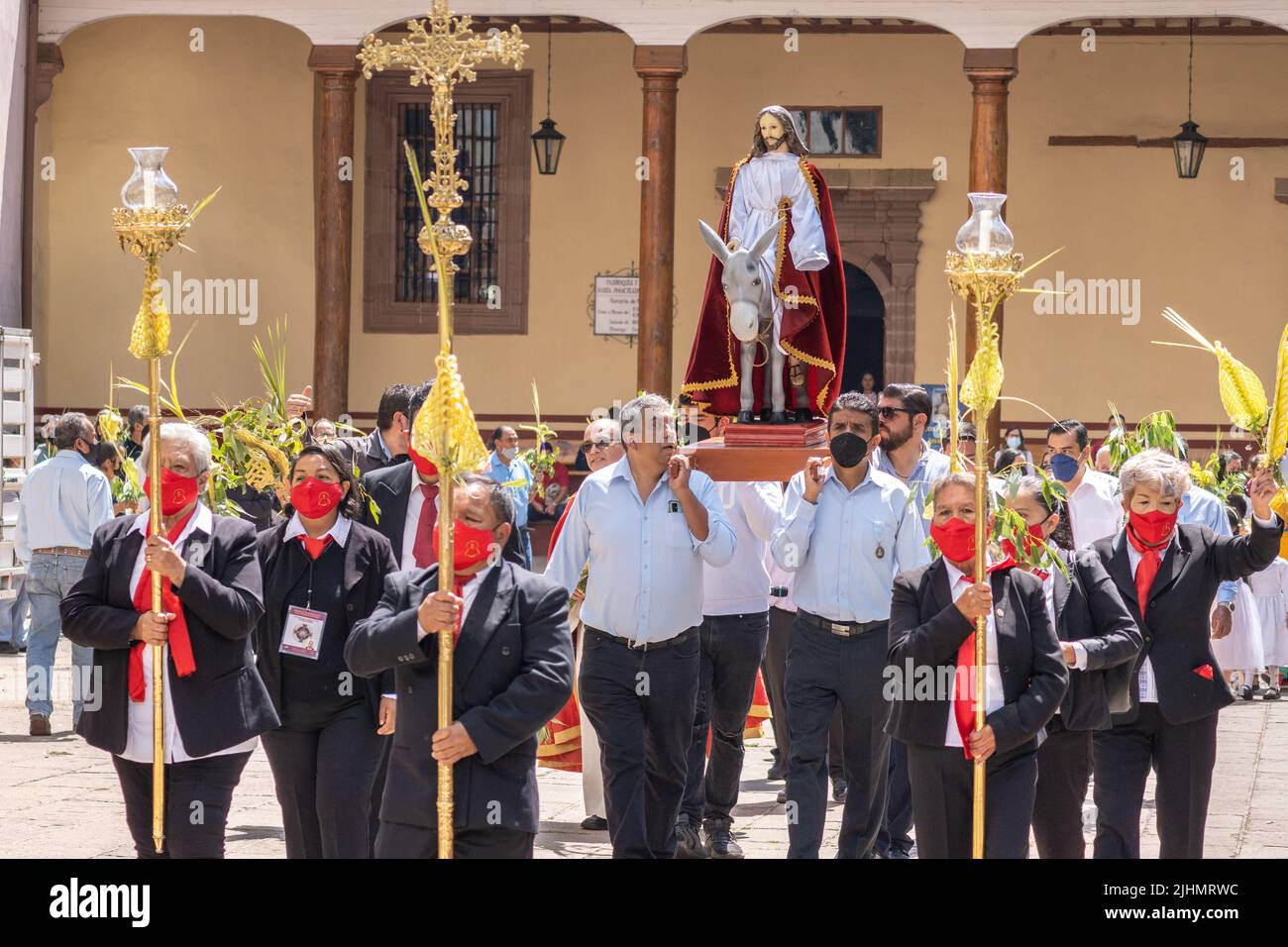 Mexican Christians, carry a statue of Jesus Christ, during a Palm ...