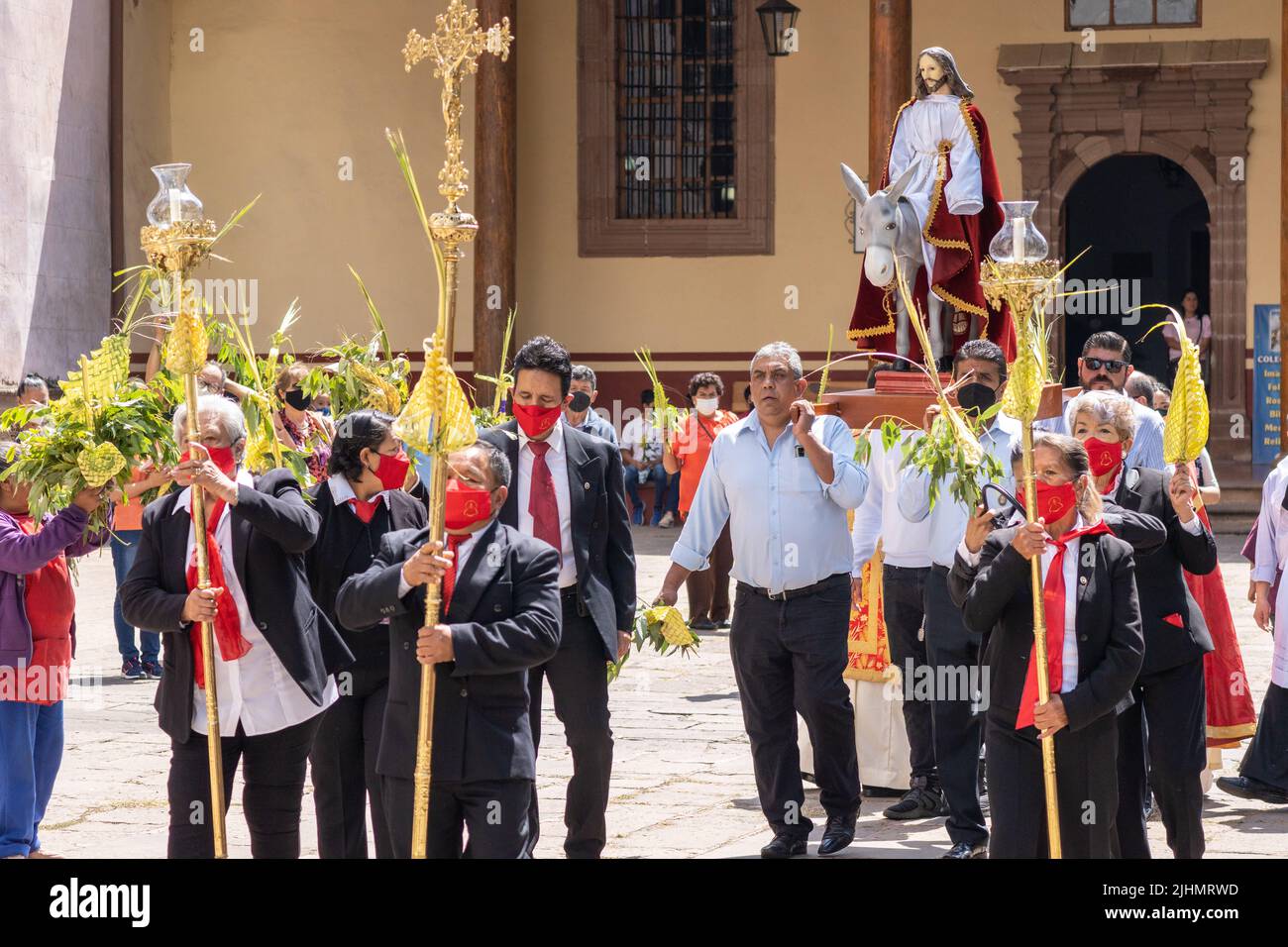 Mexican Christians, carry a statue of Jesus Christ, during a Palm ...