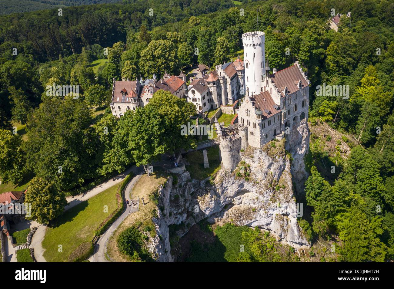 Aerial view of lichtenstein castle (Schloss) on forested rock cliff in ...