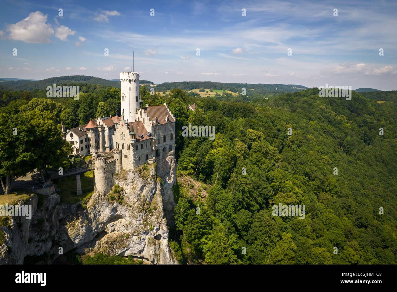 Aerial view of lichtenstein castle (Schloss) on forested rock cliff in ...