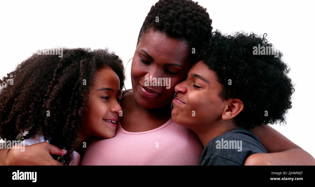 Loving mother and kids hug. Mom embracing children. African ethnicity ...