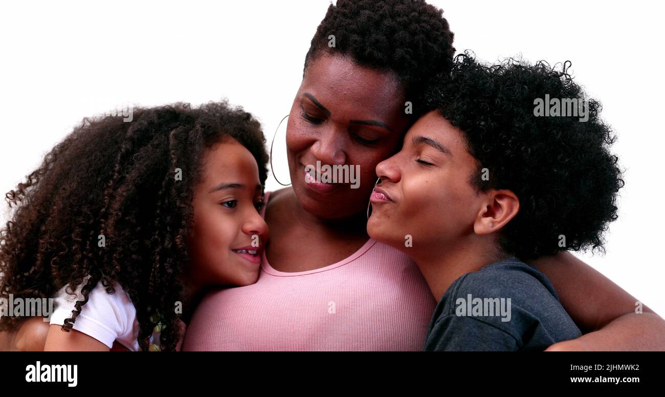 Loving mother and kids hug. Mom embracing children. African ethnicity ...