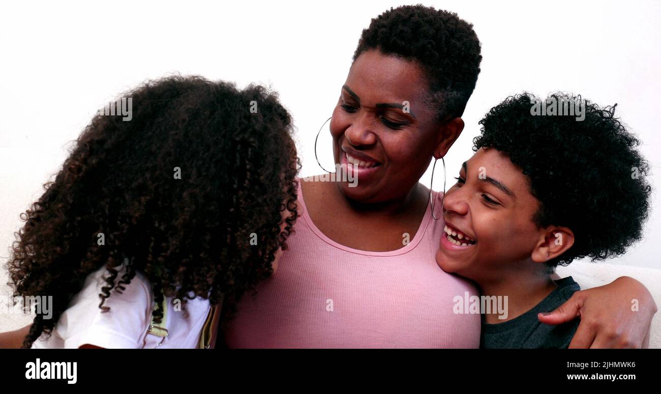 Loving mother and kids hug. Mom embracing children. African ethnicity ...