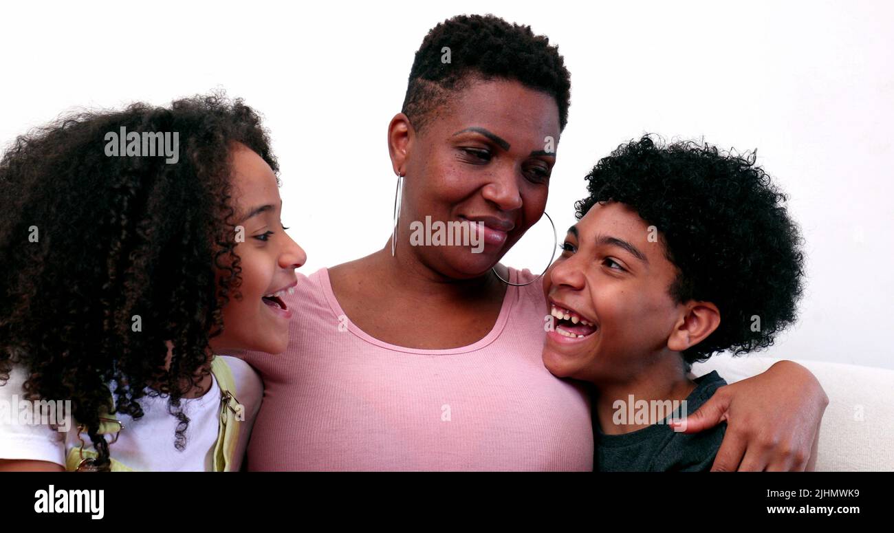 Loving mother and kids hug. Mom embracing children. African ethnicity ...